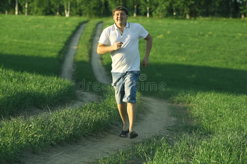 Man Running in Sunset Summer Field Stock Image - Image of speed, grass ...