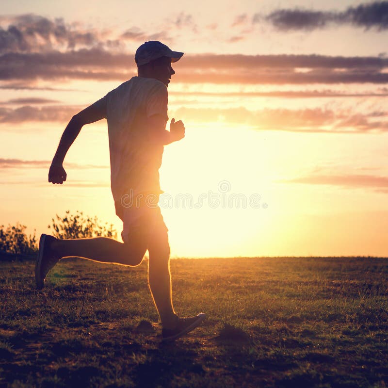 Man running at Sunset stock photo. Image of horizon, happy - 98465398