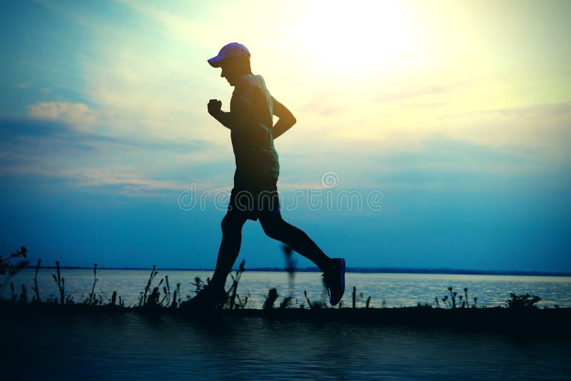 Man running at Sunset stock photo. Image of rural, action - 72142356
