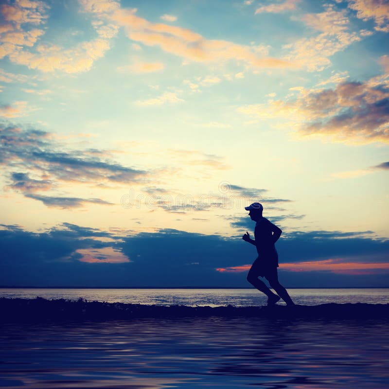 Man running at Sunset stock photo. Image of idyllic, dusk - 72142256