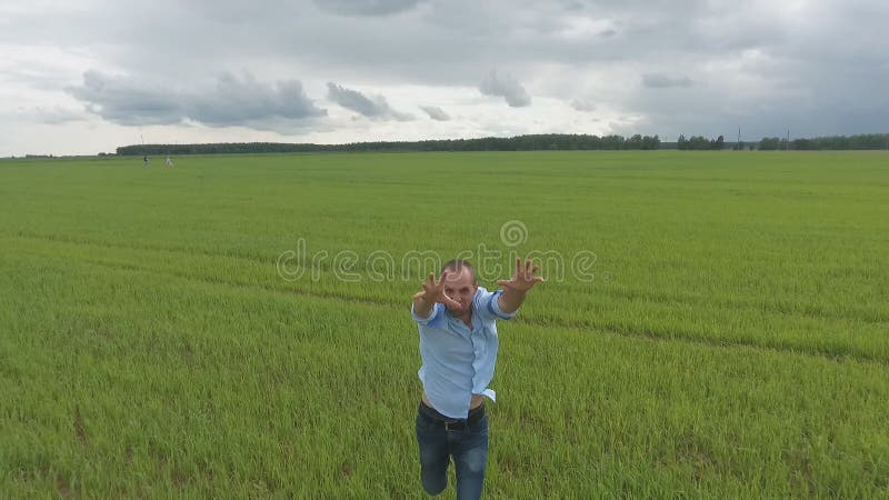 Man Running To Camera in Field Stock Video - Video of sporty, nature ...
