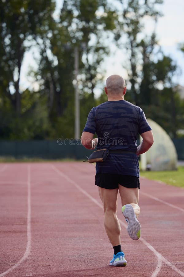 Man Running on a Running Track Stock Image - Image of motion, active ...