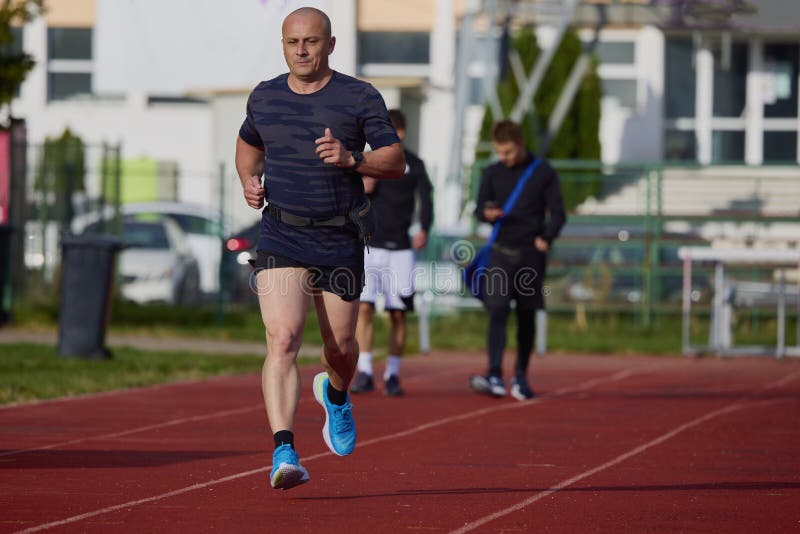 Man Running on a Running Track Stock Photo - Image of sport, endurance ...