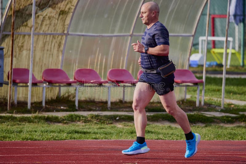 Man Running on a Running Track Stock Photo - Image of sportswear ...