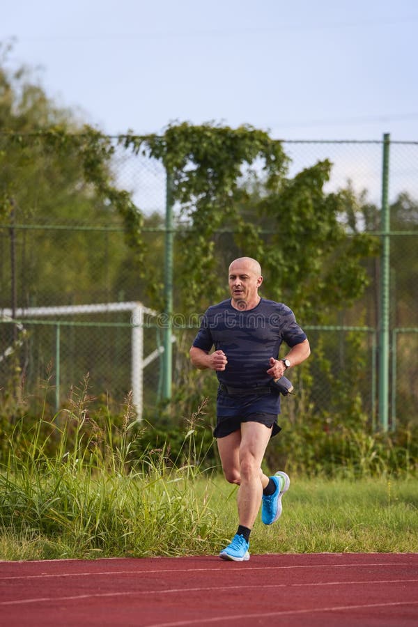 Man Running on a Running Track Stock Image - Image of lifestyle, people ...