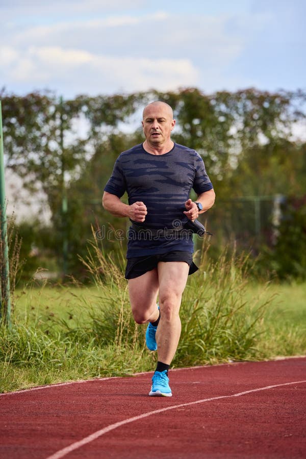 Man Running on a Running Track Stock Photo - Image of marathon, summer ...
