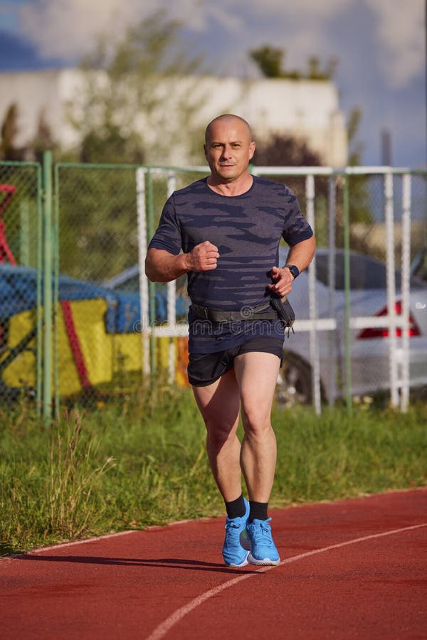 Man Running on a Running Track Stock Photo - Image of athletic, life ...