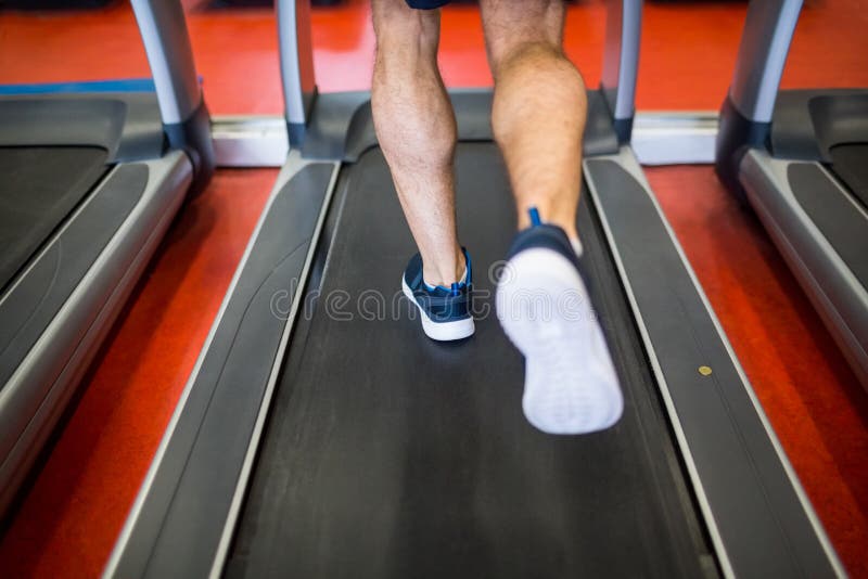 Man running on a treadmill stock image. Image of attractive - 60891645