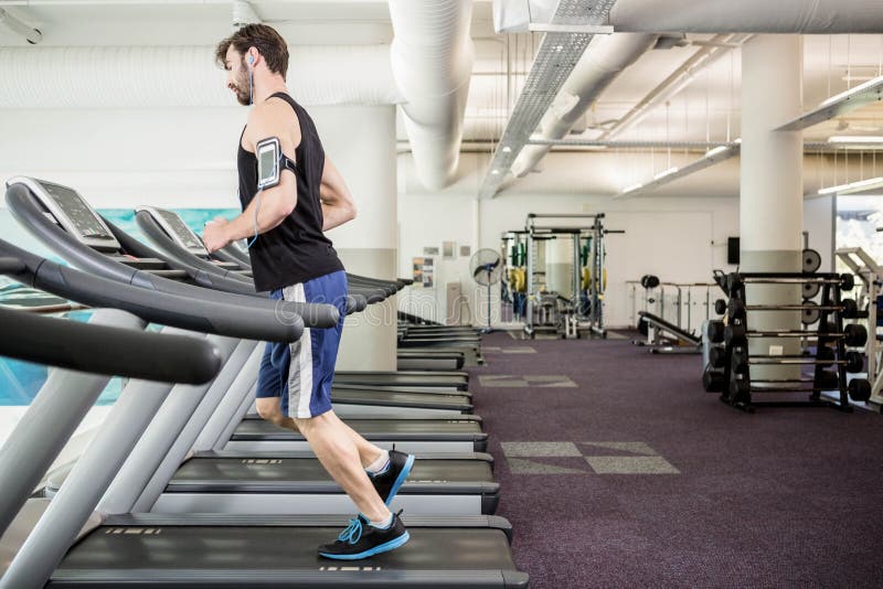 Man running on treadmill stock image. Image of focused - 66432859