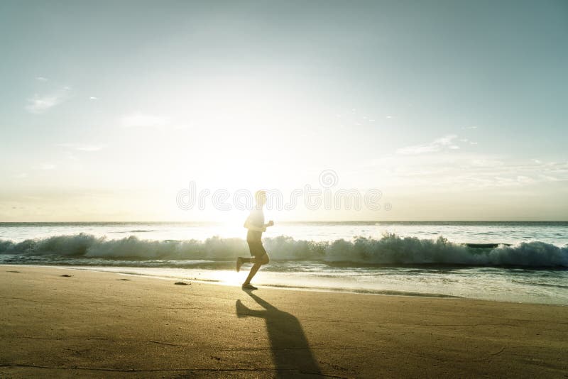 Man Running on Tropical Beach at Sunset Stock Photo - Image of forward ...