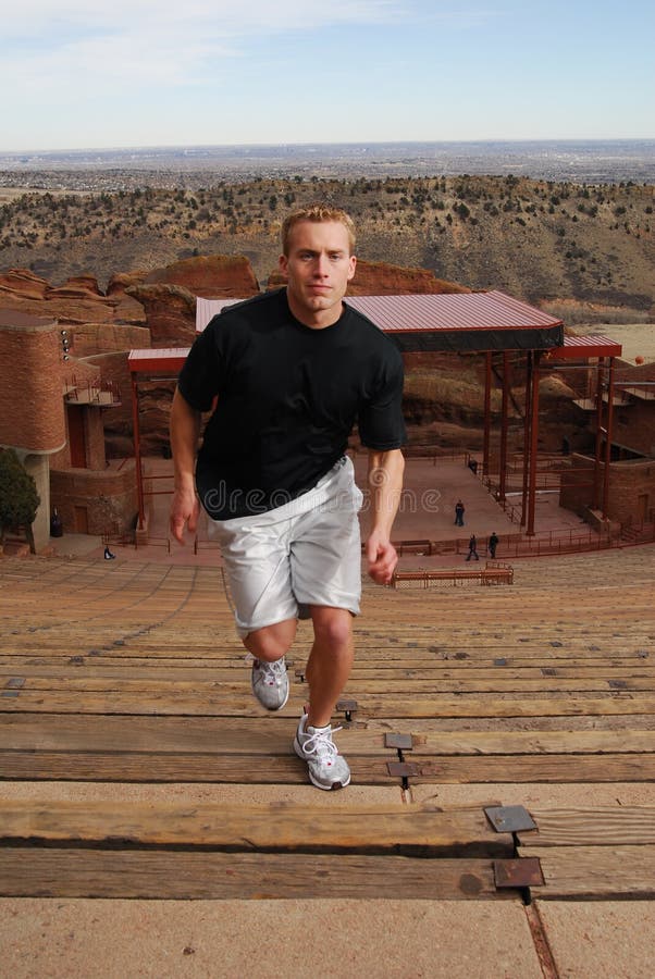 Man running up steps stock photo. Image of amphitheater - 9902142