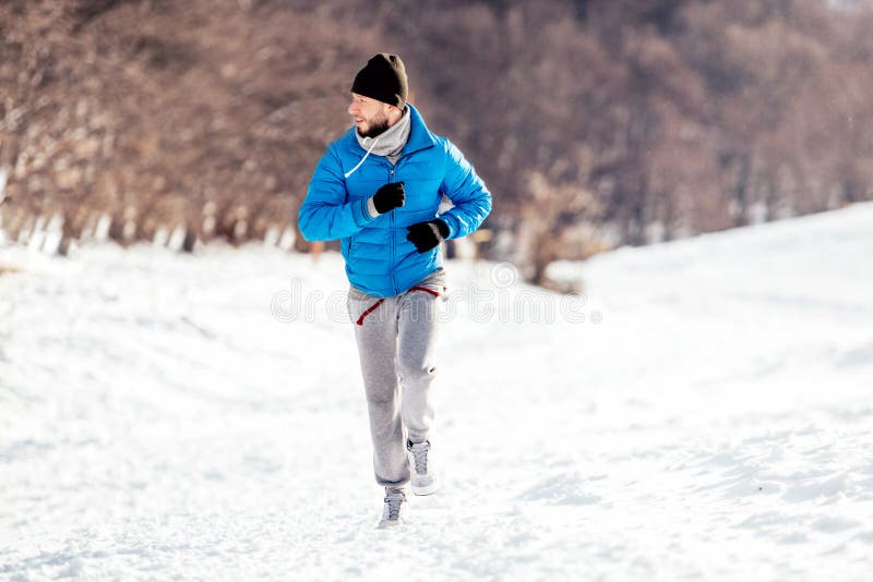 Man Running and Working Out on a Snowy Winter Day Stock Image - Image ...