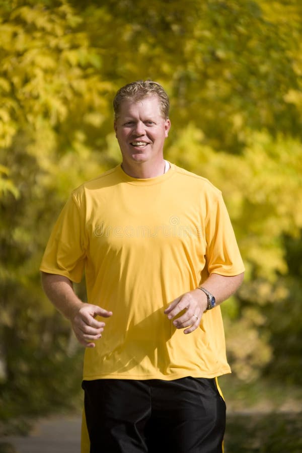 Man running in yellow stock image. Image of healthy, exercise - 11231277