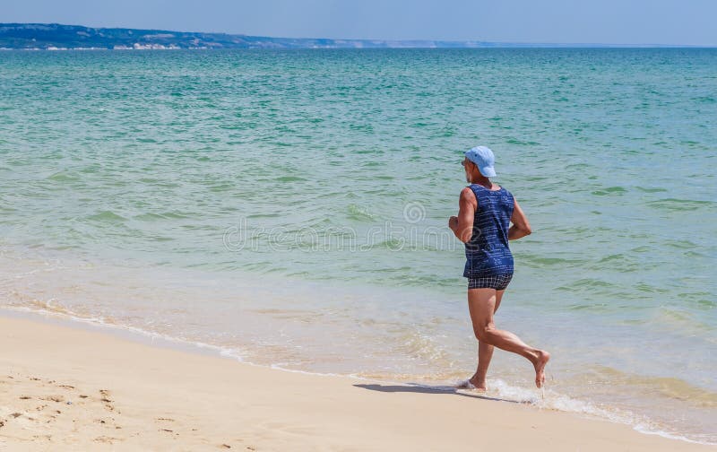 Man Runs Along the Seashore Stock Photo - Image of keeping, male: 88057974