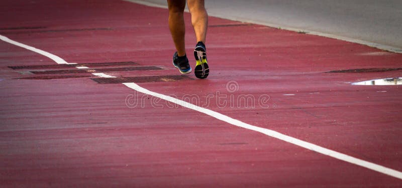 Runner`s Feet at the Track stock image. Image of body - 130978395