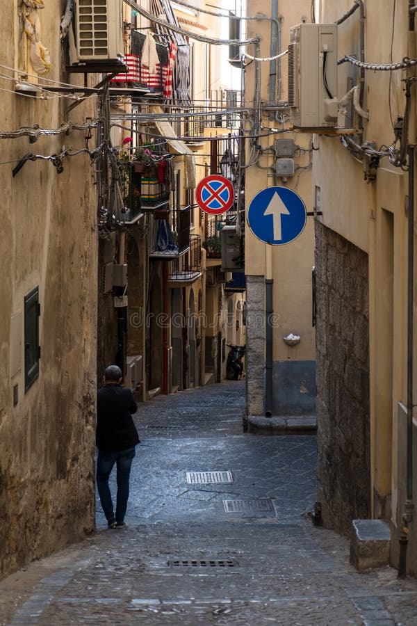 Man`s Back in the Alleys of Cefalu in Sicily Editorial Stock Photo ...