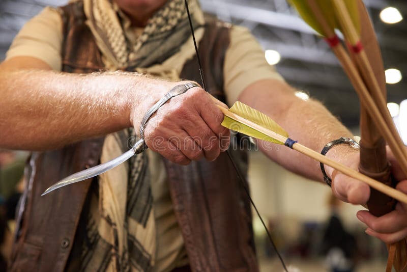 In the Man`s Bowler in the Hands of Wooden Bow Stock Image - Image of ...