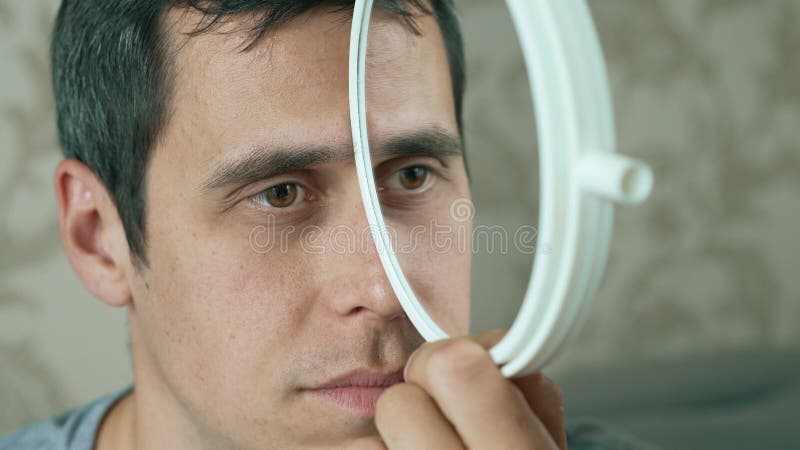 Man Makes a Funny Face Using a Mirror Stock Video - Video of squint ...