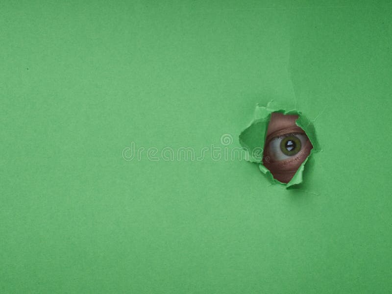 The Man`s Eye Looks through the Hole Stock Photo - Image of closeup ...