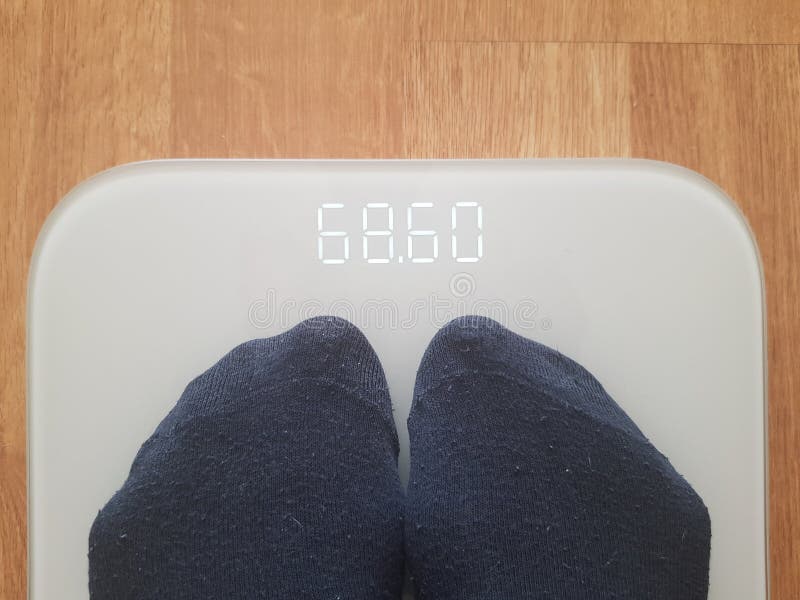 The Man S Feet are on the Scales Stock Photo - Image of black, organ ...