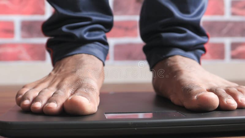 Man S Feet on Weight Scale Close Up. Stock Video - Video of electronic ...