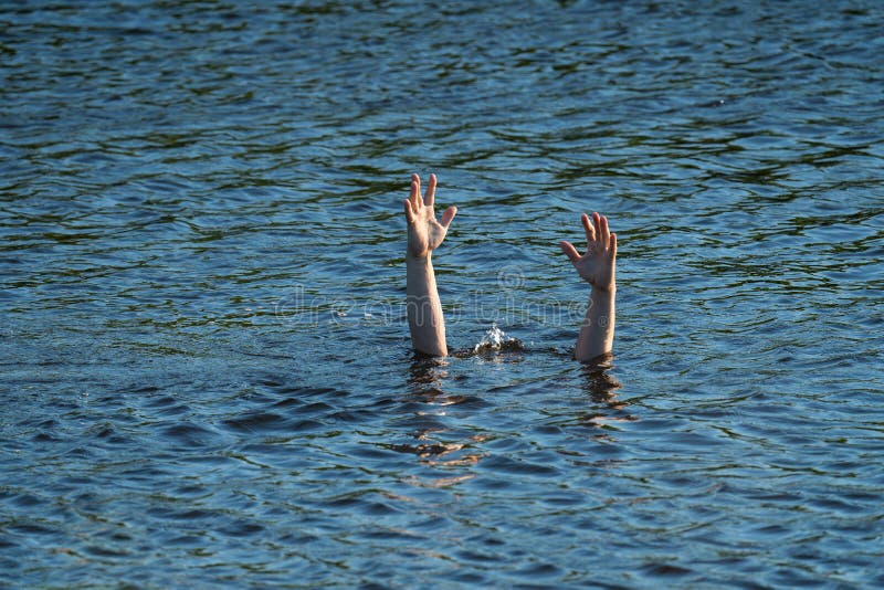 A Man`s Hand Above the Surface of the Water in the River, Saving ...