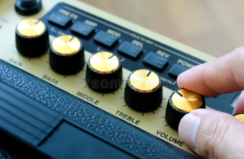 Man`s Hand is Adjusting the Music Volume from the Amplifier Stock Photo ...