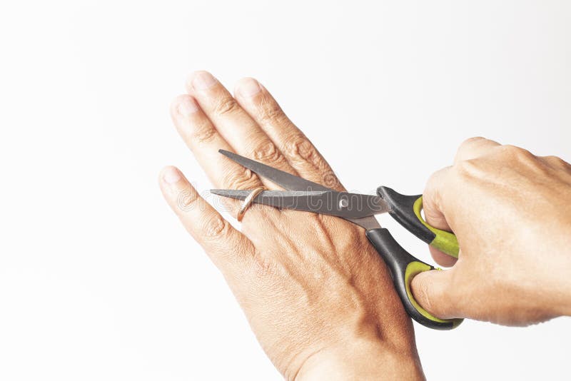 Man& X27;s Hand Cuts an Engagement Ring with Scissors Stock Photo ...