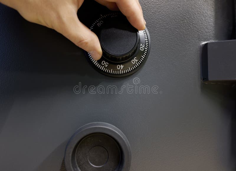A Man& X27;s Hand Dials a Code on the Limb of the Safe by Rotating it ...
