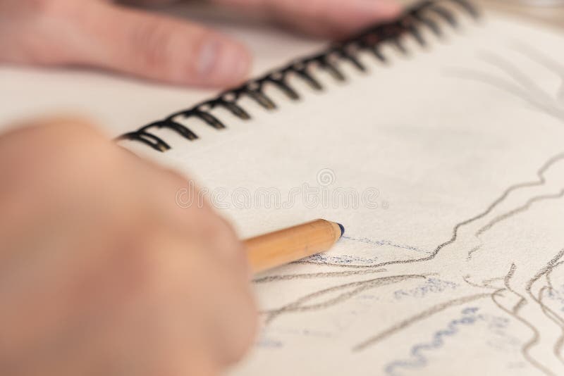 Man`s Hand Drawing with a Colored Pencil Stock Photo - Image of ...