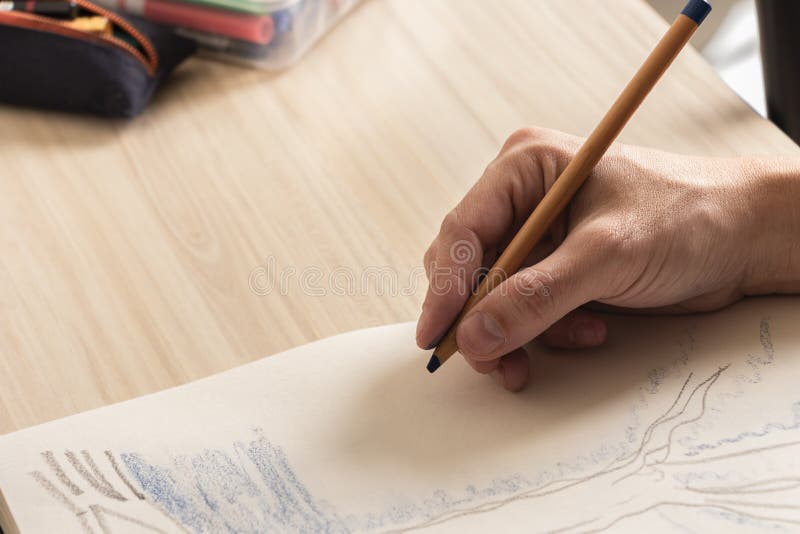Man`s Hand Learning How To Draw with a Colored Pencil Stock Photo ...