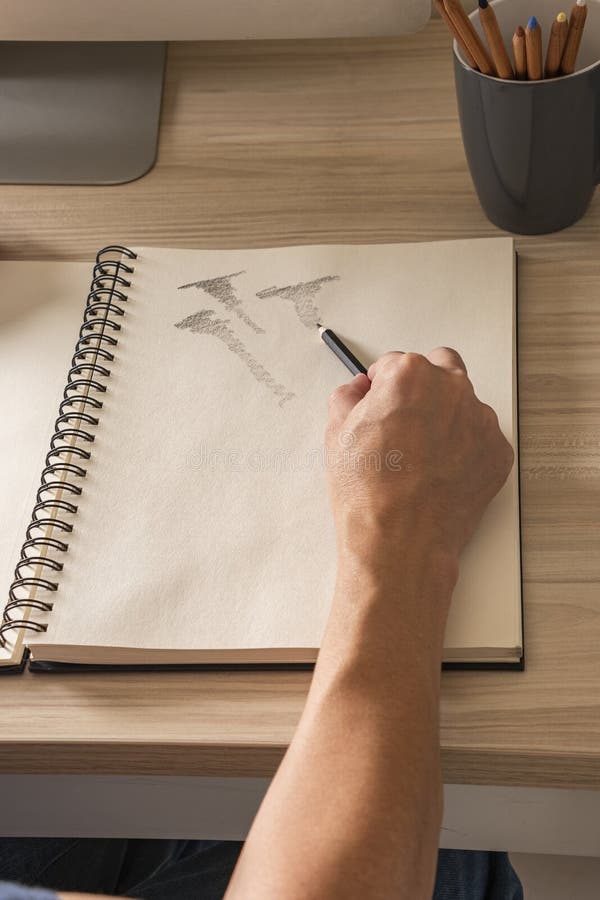 Man`s Hand Drawing in a Notebook Stock Photo - Image of blank, human ...