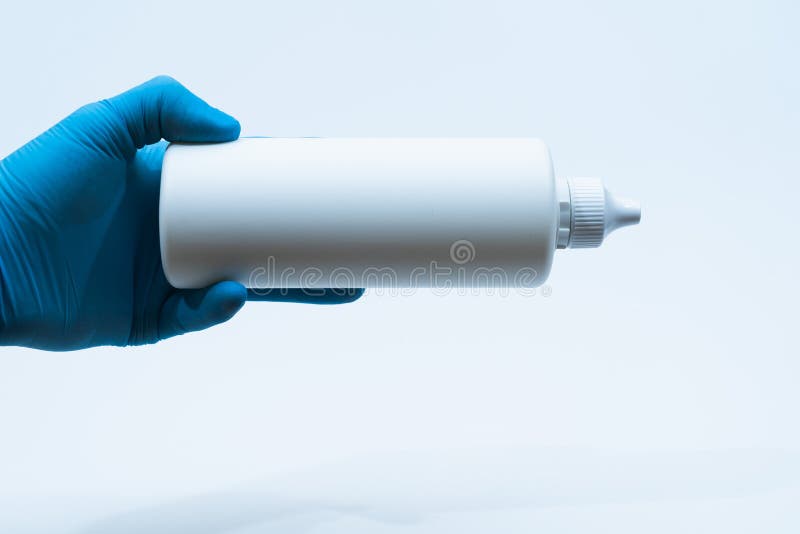 Man`s Hand in Glove Holds a White Plastic Bottle Stock Photo - Image of ...