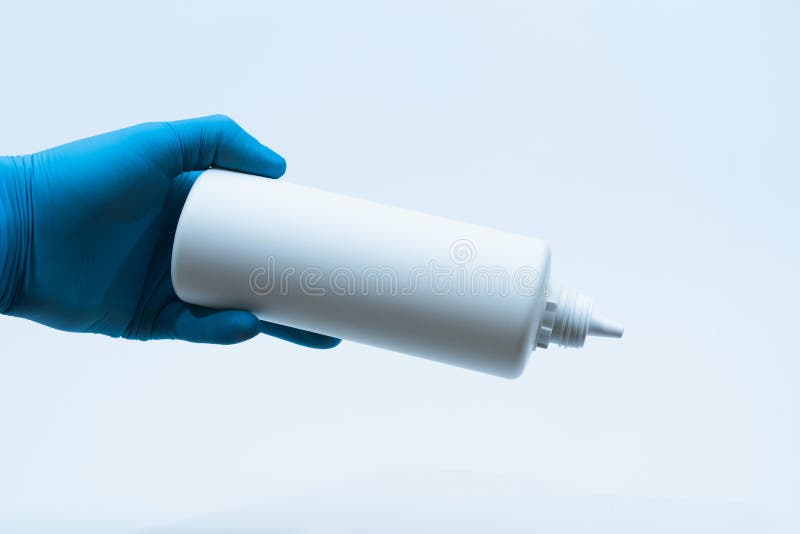 Man`s Hand in Glove Holds a White Plastic Bottle Stock Image - Image of ...