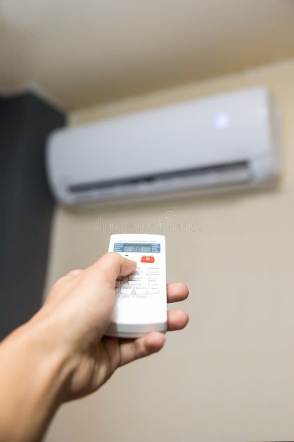 Man`s Hand Holding Air Conditioning Unit Remote Control Stock Image ...
