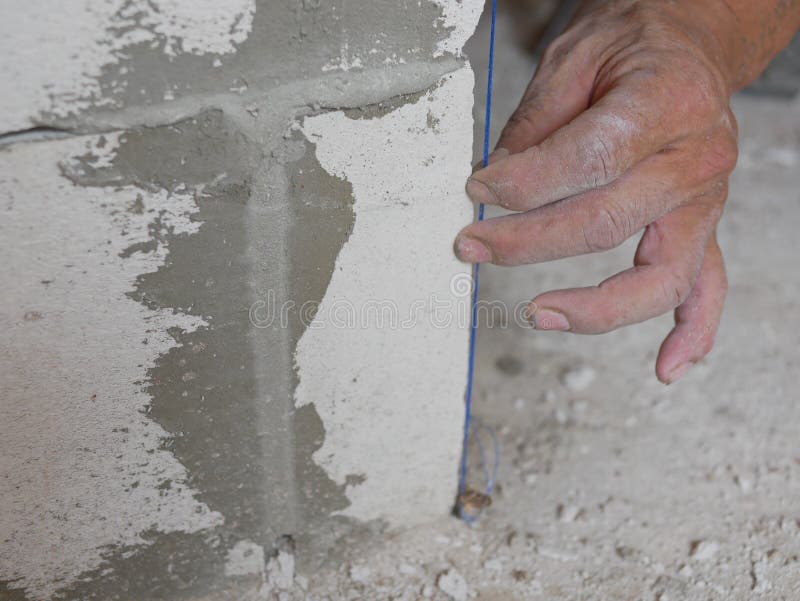 Vertical plumb bob stock photo. Image of bricklayering - 36829538