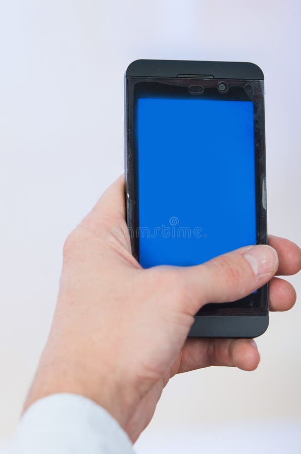 Man S Hand Holding Cell Phone with Empty Blue Stock Photo - Image of ...