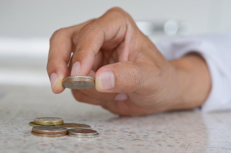 Man s hand, holding 2 coin stock image. Image of capital - 37956455