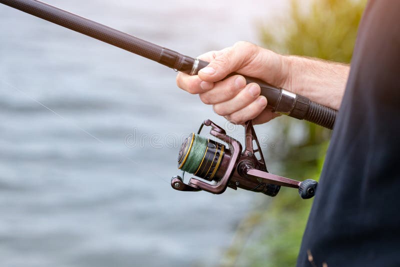 Man`s Hand Holding a Fishing Rod, Fishing Stock Image - Image of bait ...