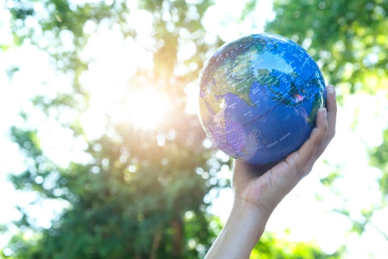 Man S Hand Holding a Globe, Showing the World S Healing, Protecting the ...