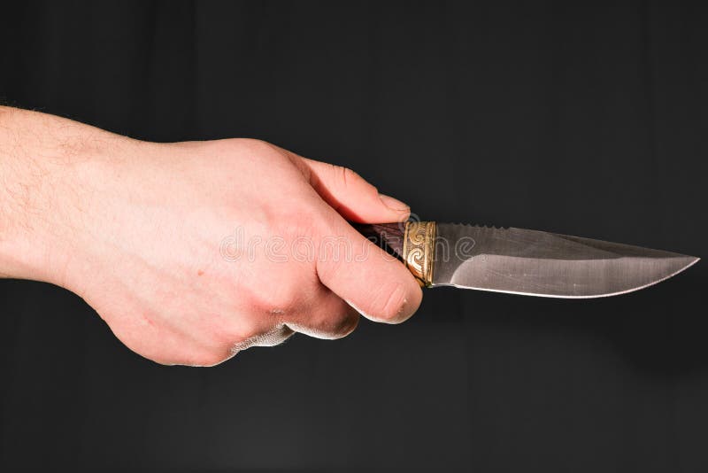 Hand holding dagger stock photo. Image of metal, grip - 7641354