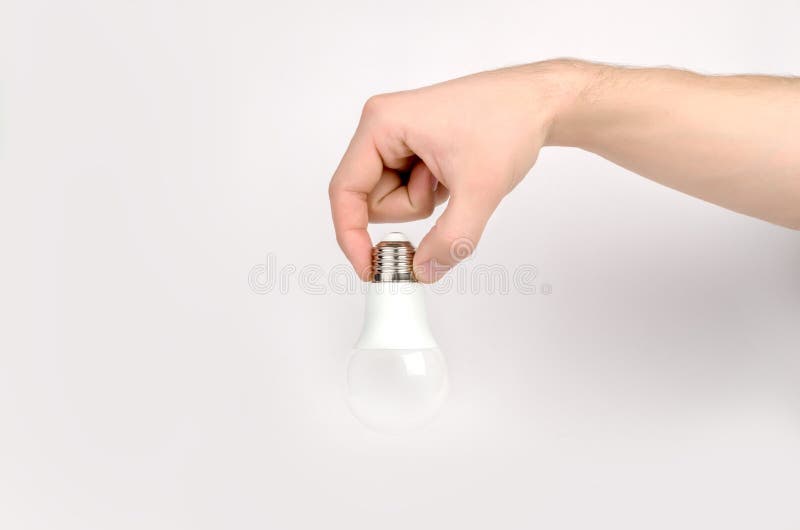 Man`s Hand Holding the LED Lamp Stock Image - Image of glowing ...