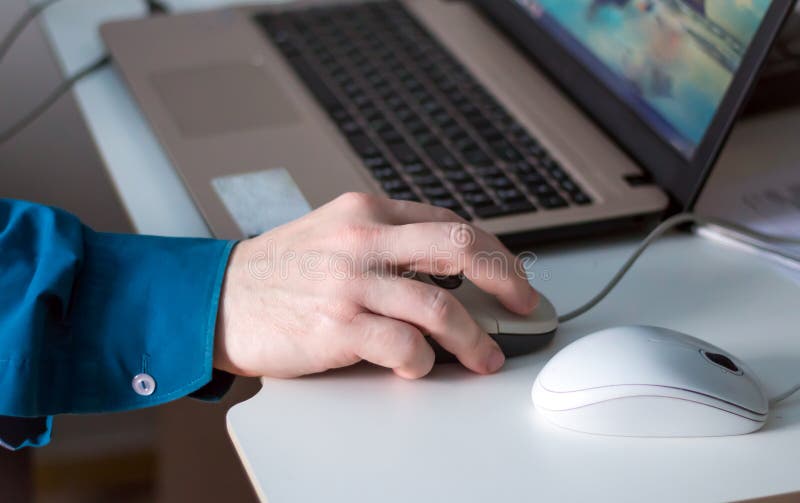 Man`s Hand Holding a Mouse for Office Work Stock Image - Image of ...