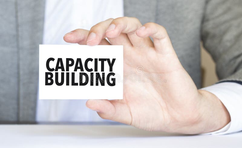Man S Hand Holding Paper Sheet with Capacity Building Words Stock Image ...