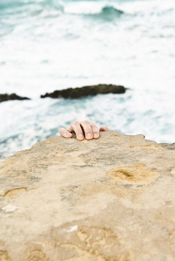 Man`s Hand Holding on To a Rock. Stock Image - Image of desperation ...