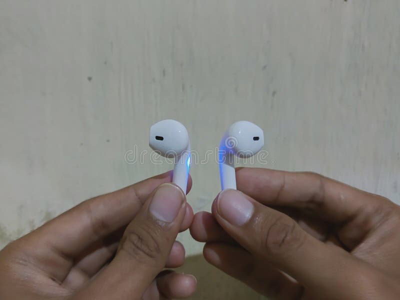 Man Hand Holding a White TWS Stock Image - Image of mans, holding ...