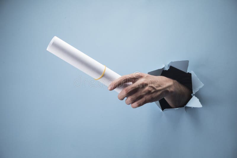 Man`s Hand Holds Papers on Blue Background Stock Image - Image of ...