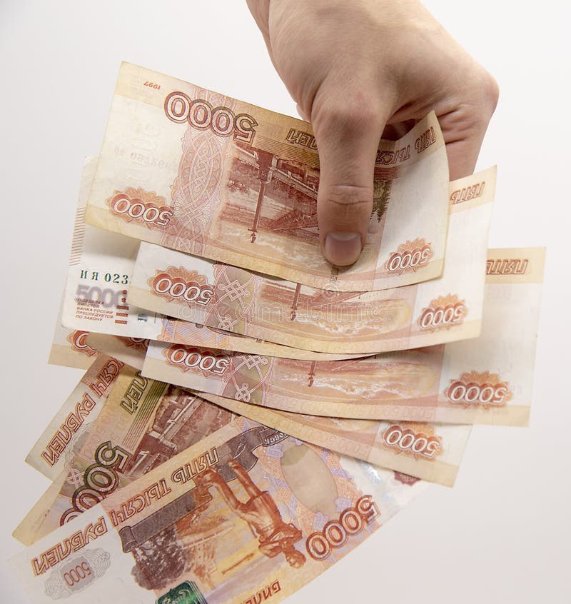 A Man`s Hand Holds a Bundle of Five Thousand Ruble Bills. Stock Image ...