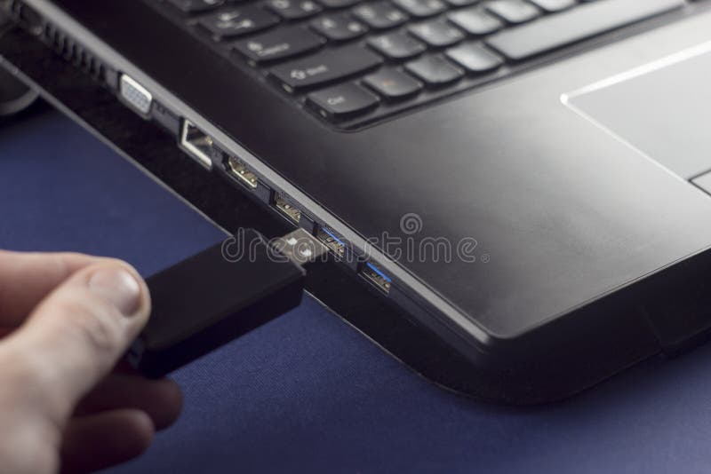 A Man`s Hand Inserts a USB Flash Drive into a Laptop Usb Stock Photo ...