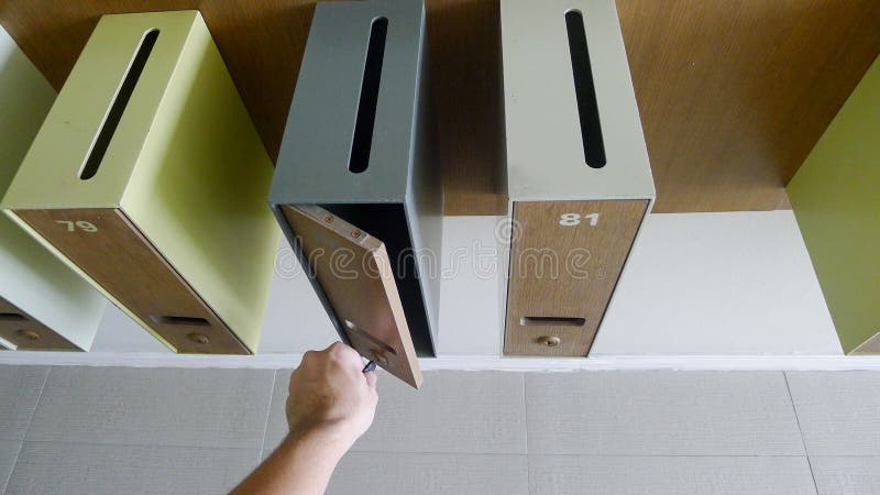 Man`s Hand with Key Unlocking a Post Box.close-up View Stock Photo ...